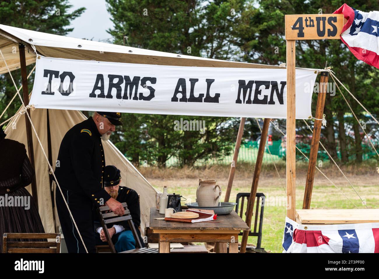 To arms all men, sign above a re-enactment of an American Civil War ...