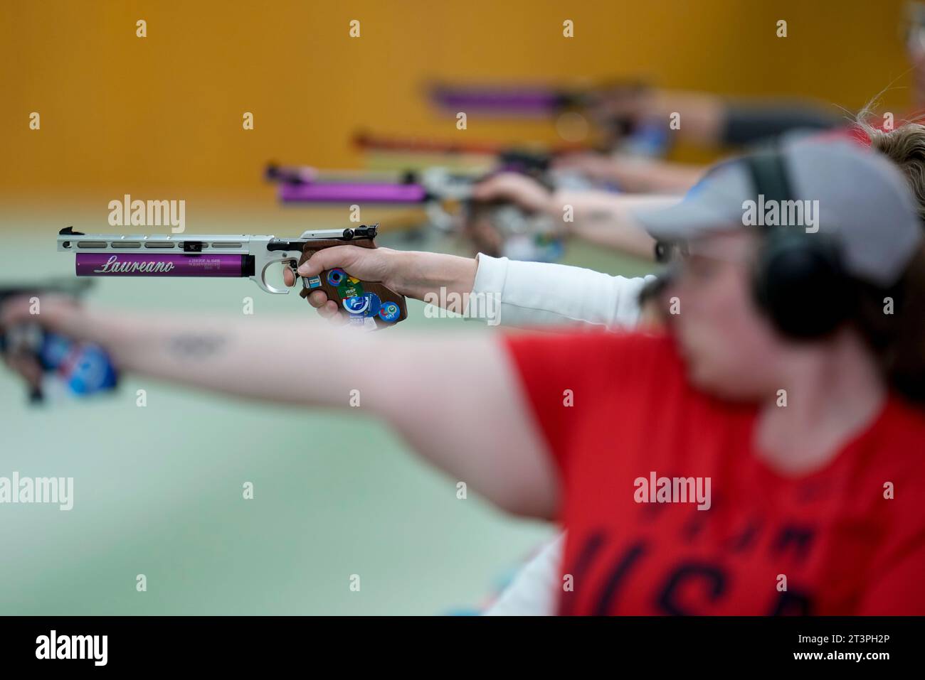 Athletes compete in the women's 10m air pistol shooting final at the ...