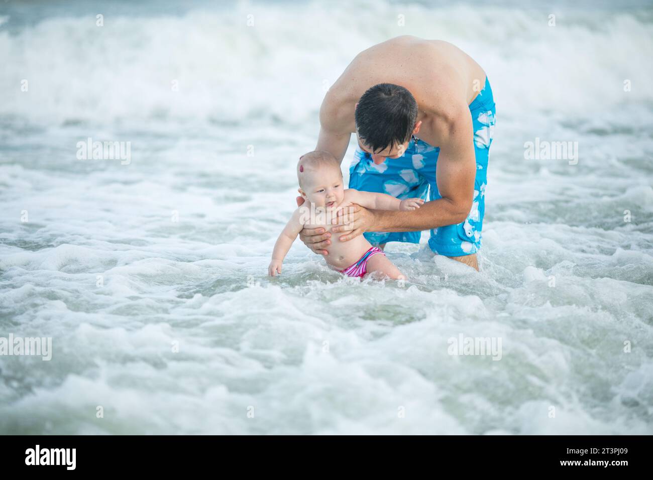 Father and baby swiming in the ocean. Dad and him Child together ...