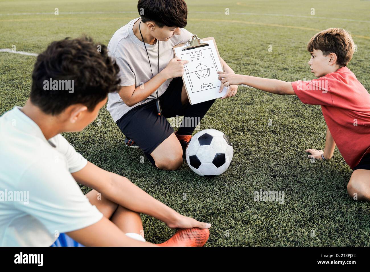 School children with coach teacher during sport training session at ...