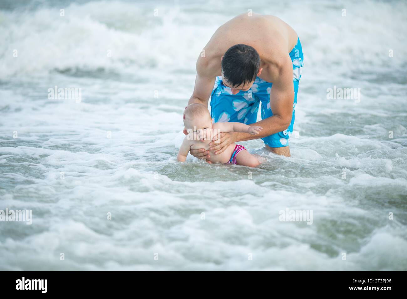Father and baby swiming in the ocean. Dad and him Child together ...