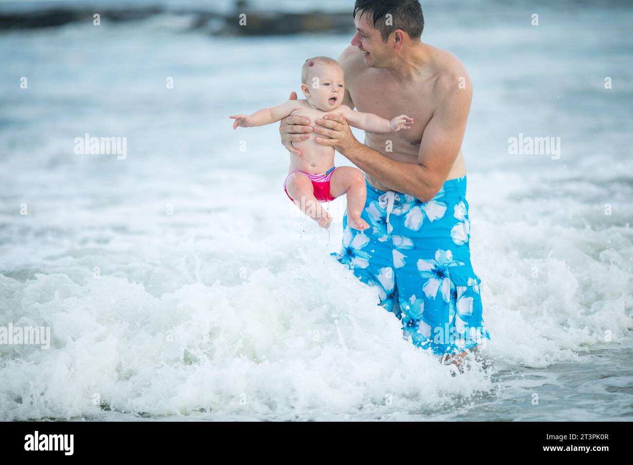 Father and baby swiming in the ocean. Dad and him Child together ...