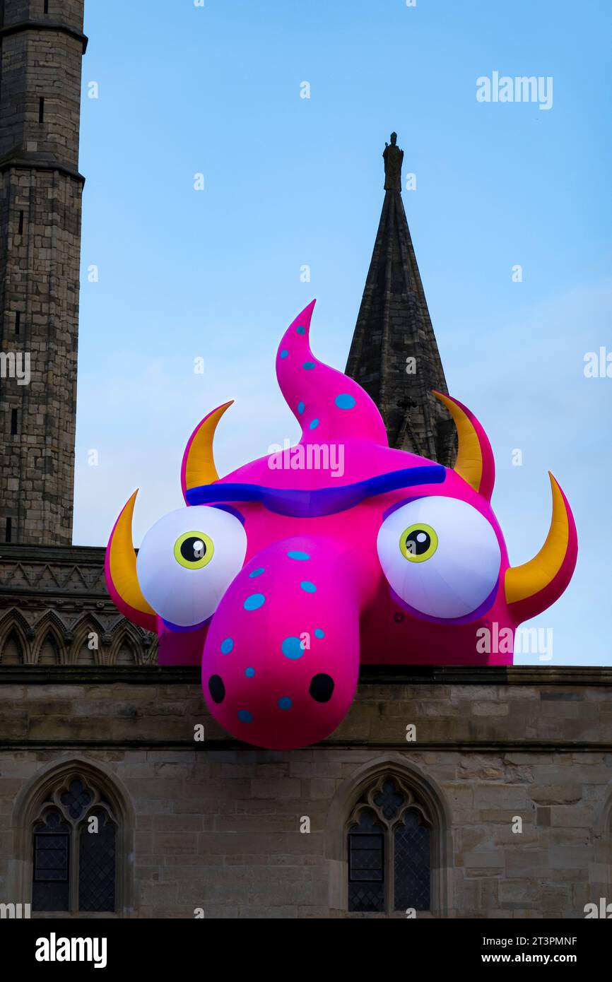 Magenta bug eyed Illuminated monster on Exchequer Gate building ...