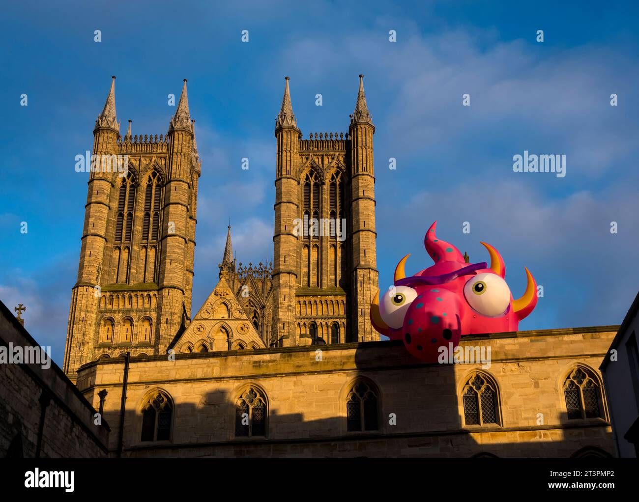 Magenta bug eyed Illuminated monster on Exchequer Gate building ...