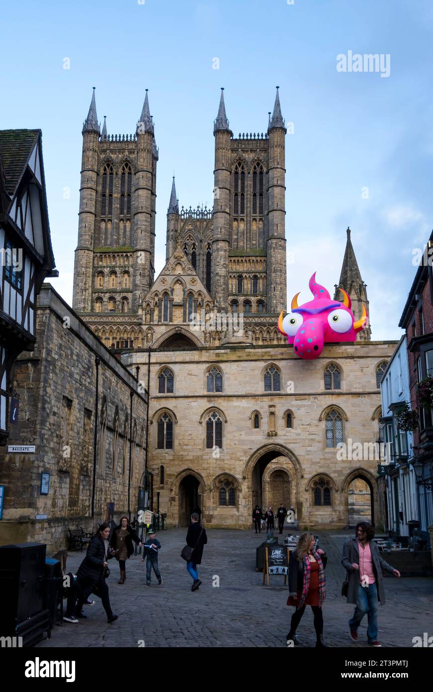 Magenta bug eyed Illuminated monster on Exchequer Gate building ...