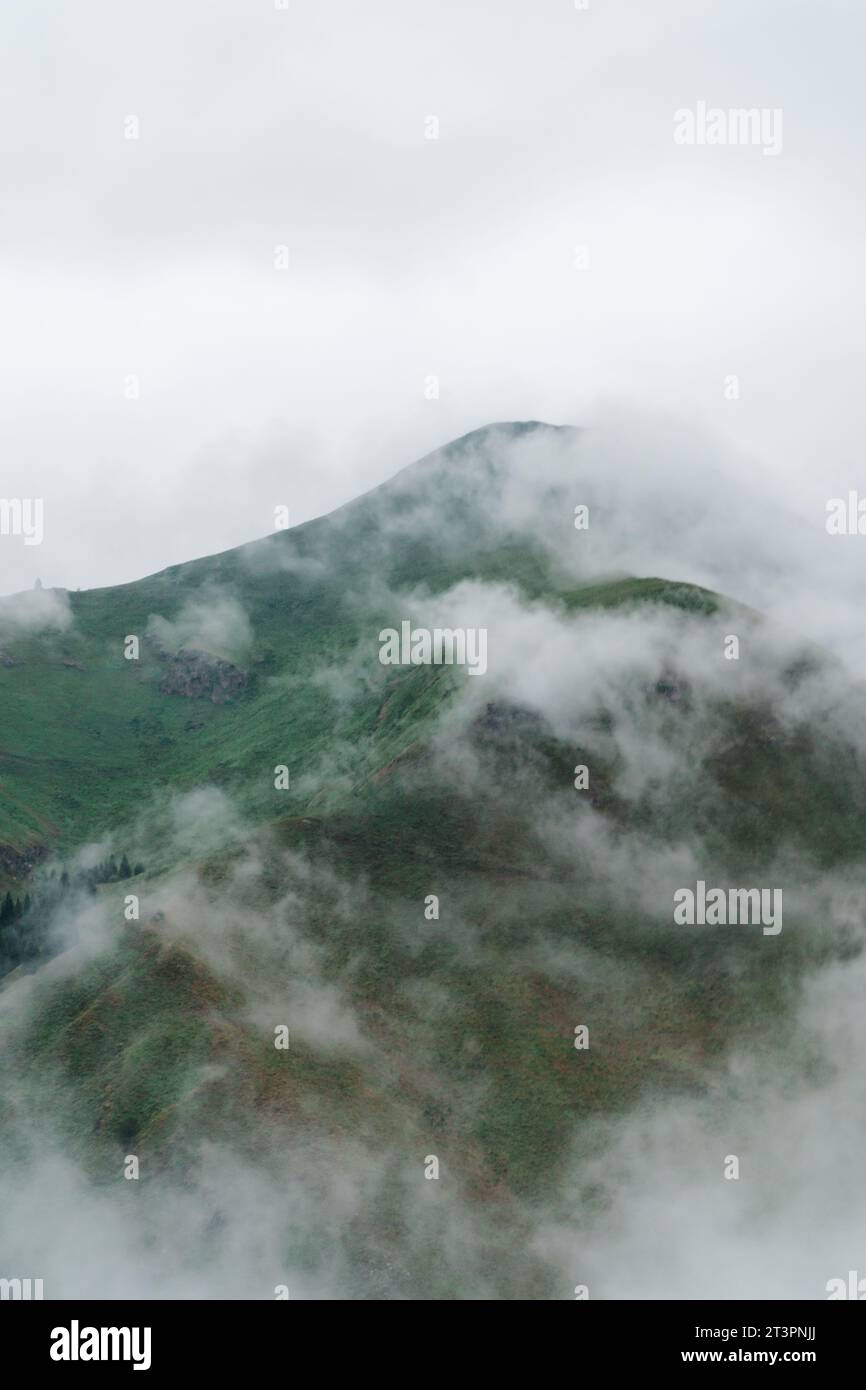 Aerial photography of the hazy primitive forest amidst clouds and mist ...