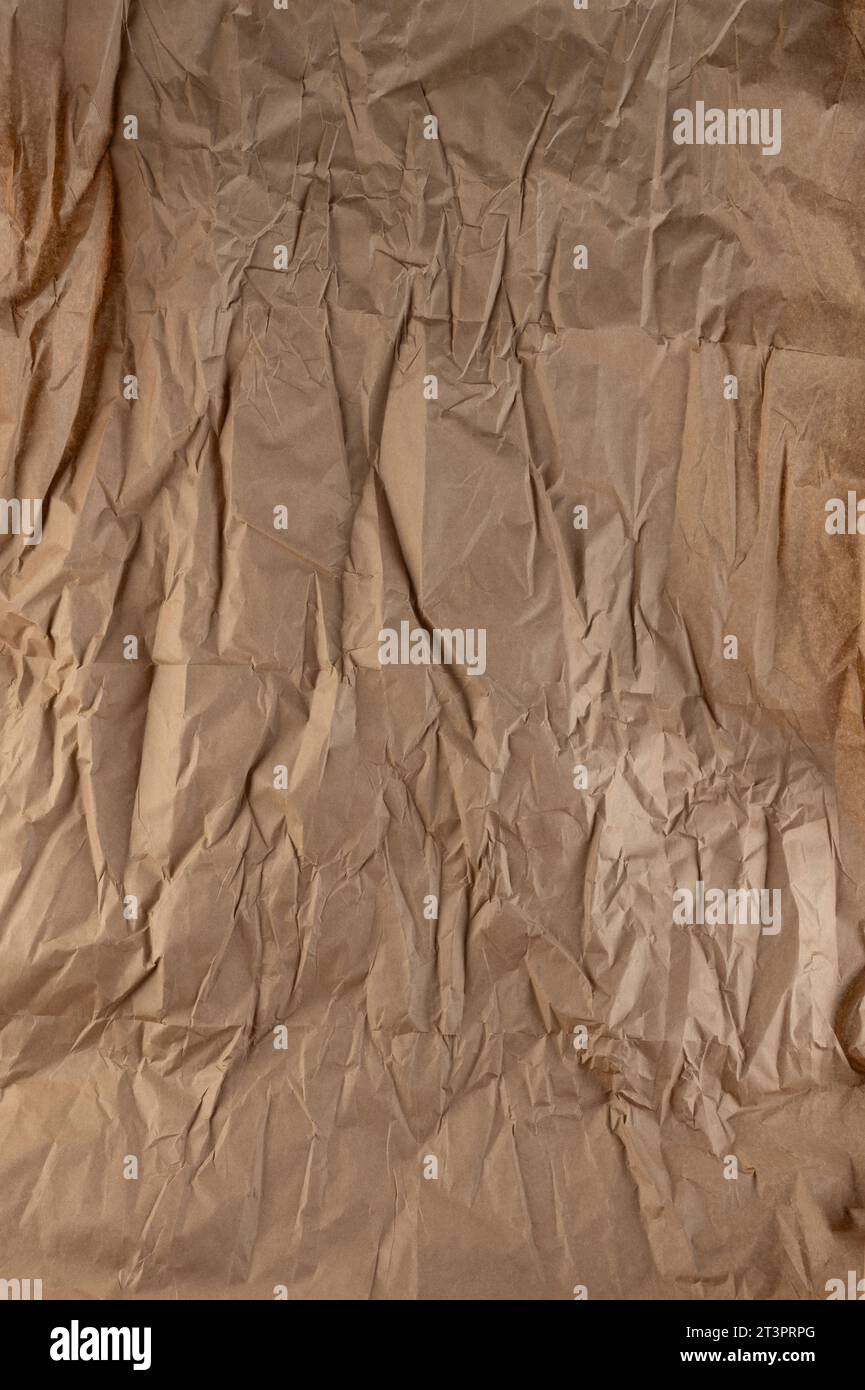 Crumpled brown recycled paper page with many fold lines Stock Photo - Alamy