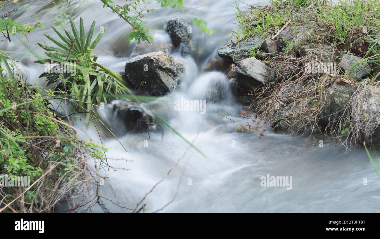 Beautiful flowing river water looking amazing Stock Photo - Alamy