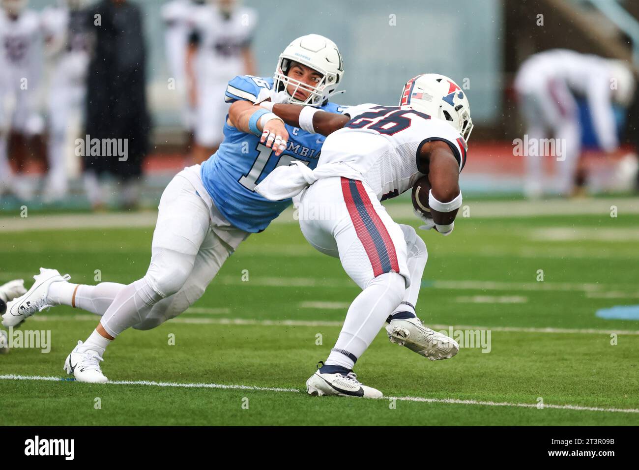 Penn Quakers running back Isaac Shabay #26 pushes off a defender during ...