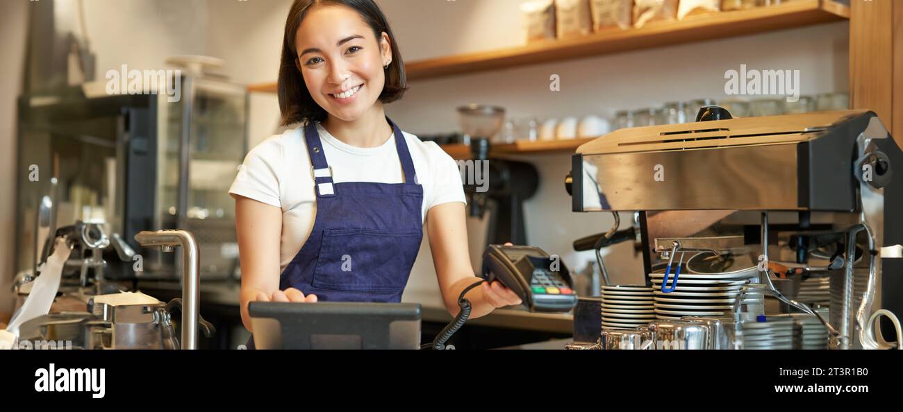 Small business and people. Smiling asian woman barista, working in cafe ...