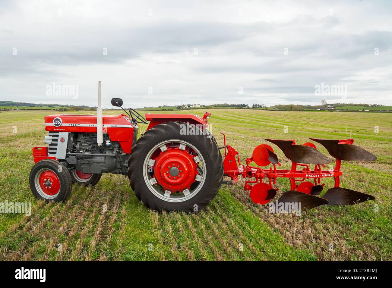 Massey Ferguson 165 and bladed plough on display at an agricultural ...