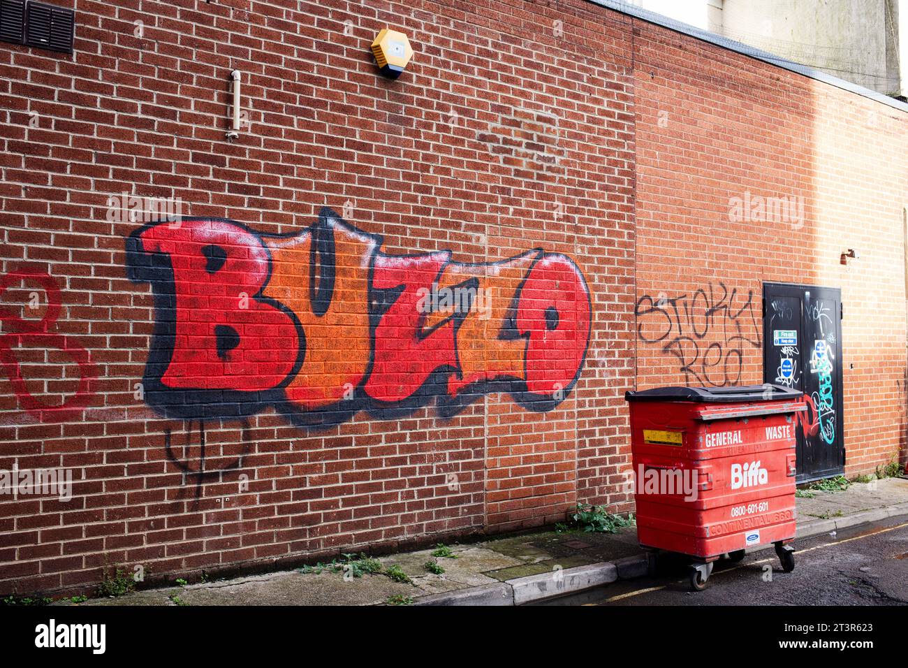 Red and orange 'Buzzo' Graffiti on red brick in Lower Union Lave behind ...