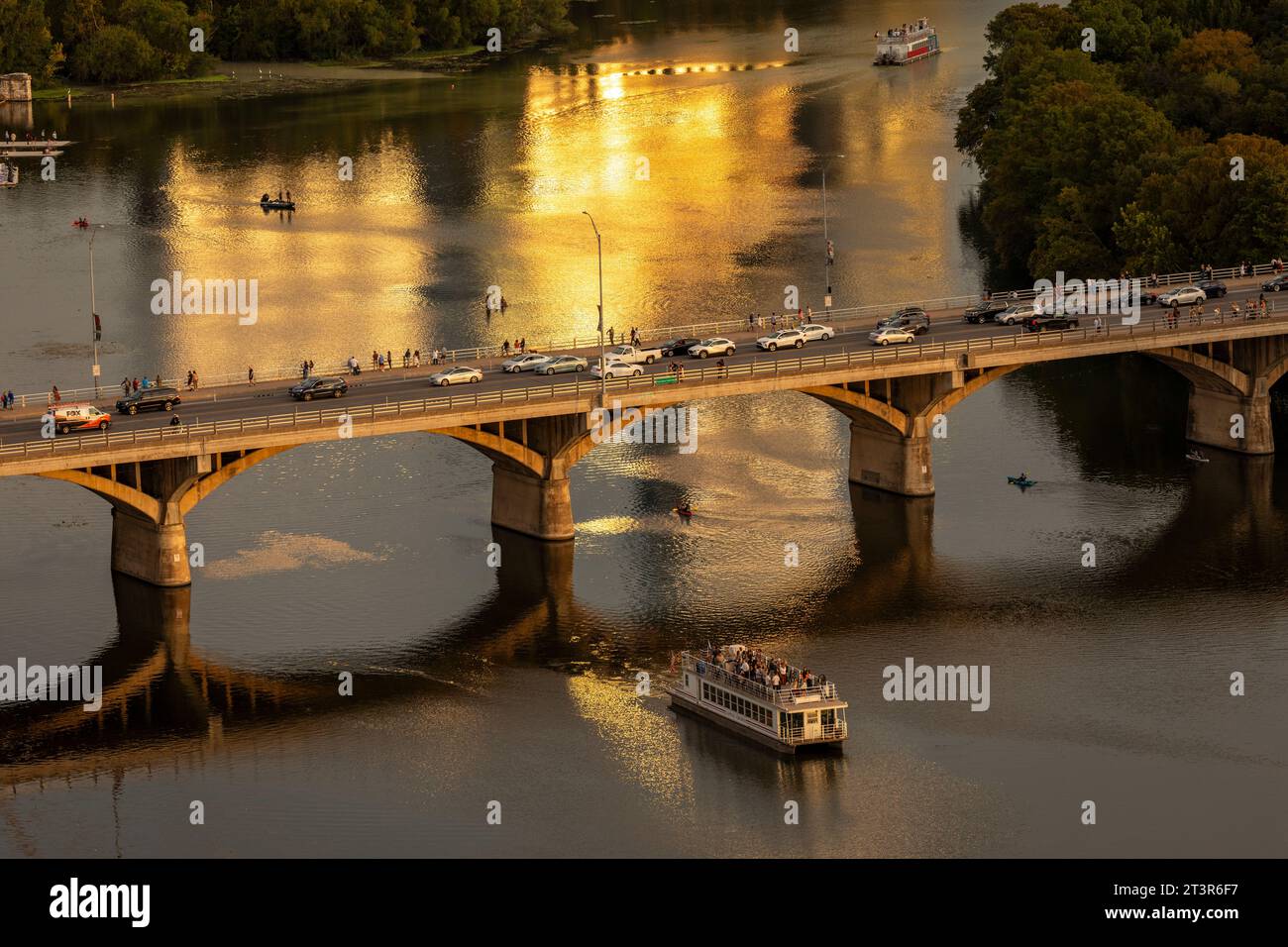 Evening reflections of Ladybird Lake, Ausin Texas with Tour Boat and ...
