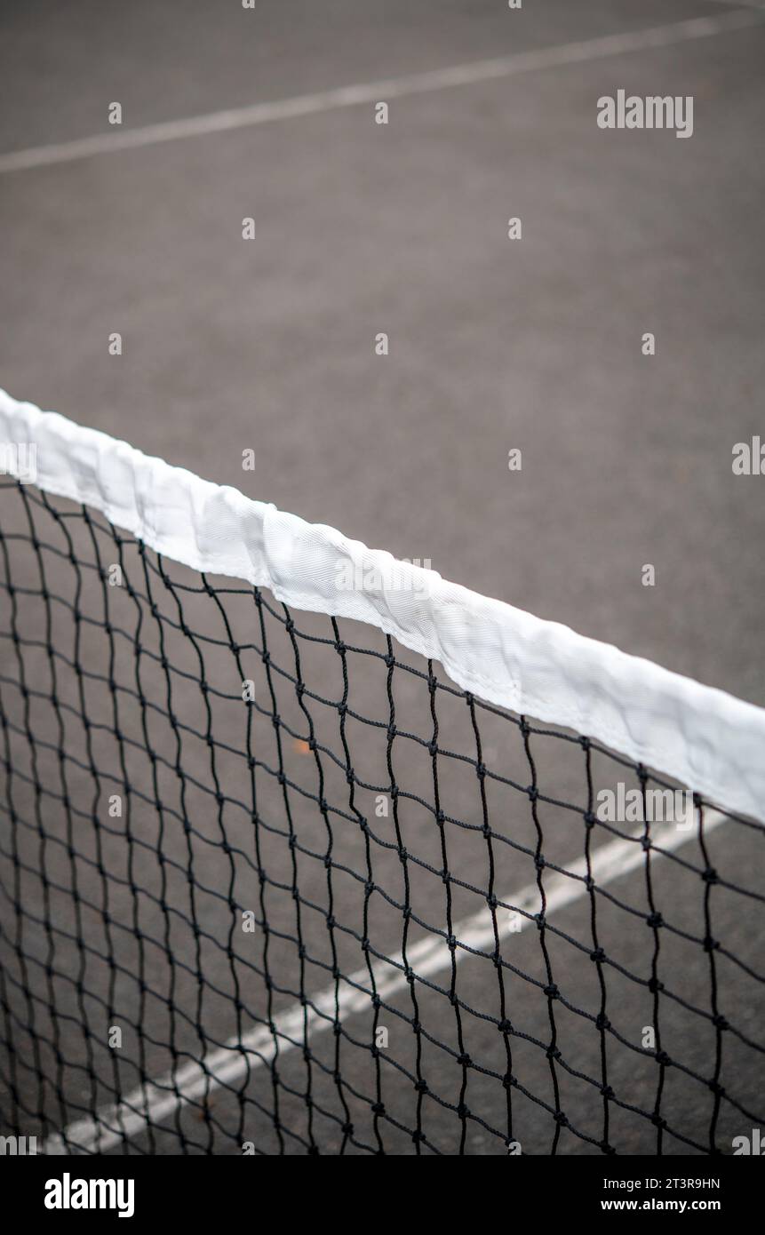 Detail of the top of a tennis net on an outside concrete court Stock ...