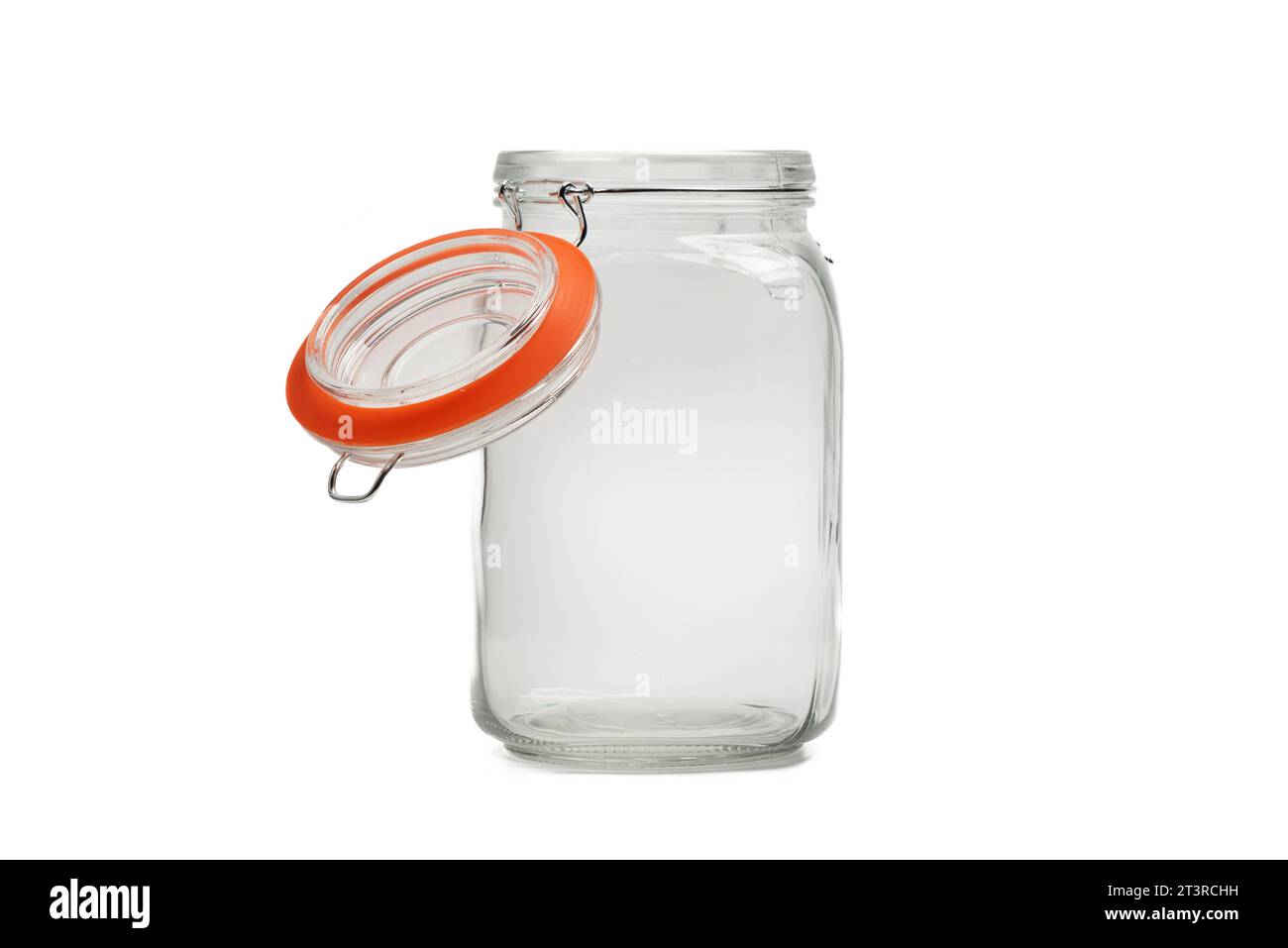 Empty glass jar for bulk products with an open lid on a white ...