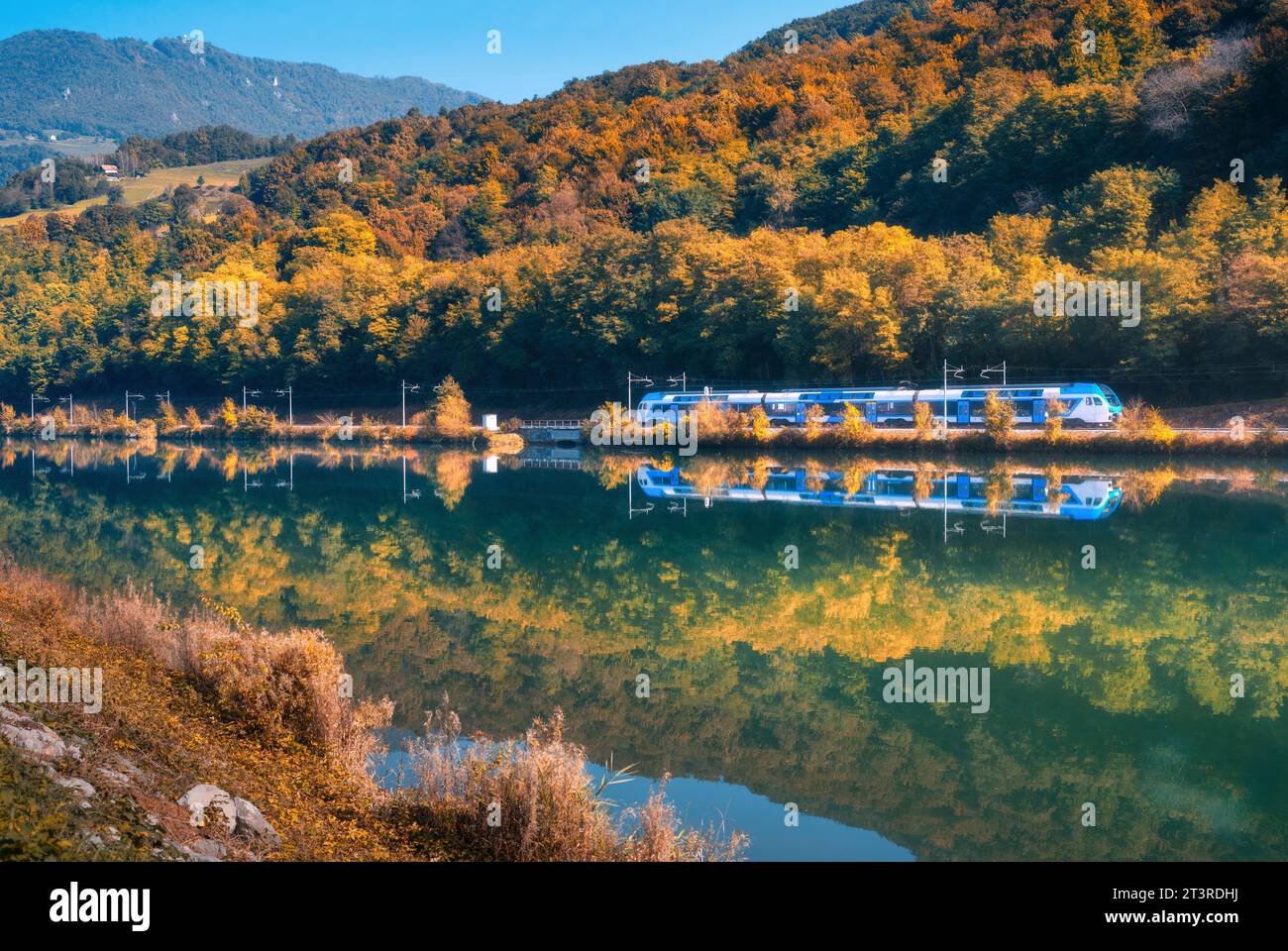 Beautiful blue modern high speed train and river in mountains Stock ...