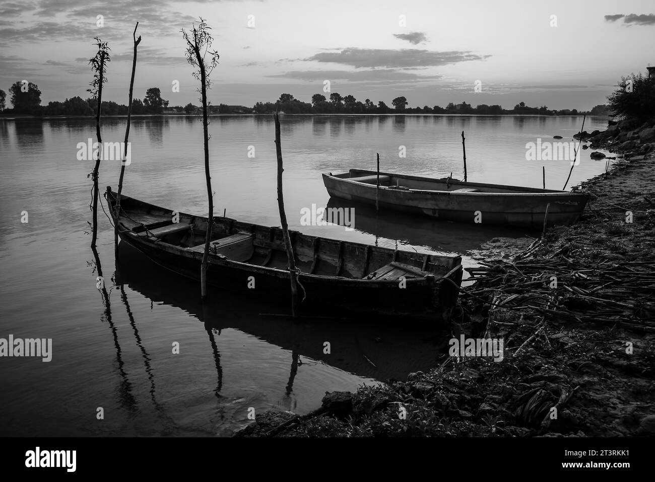 Fishing boats floating on the sea Black and White Stock Photos & Images ...