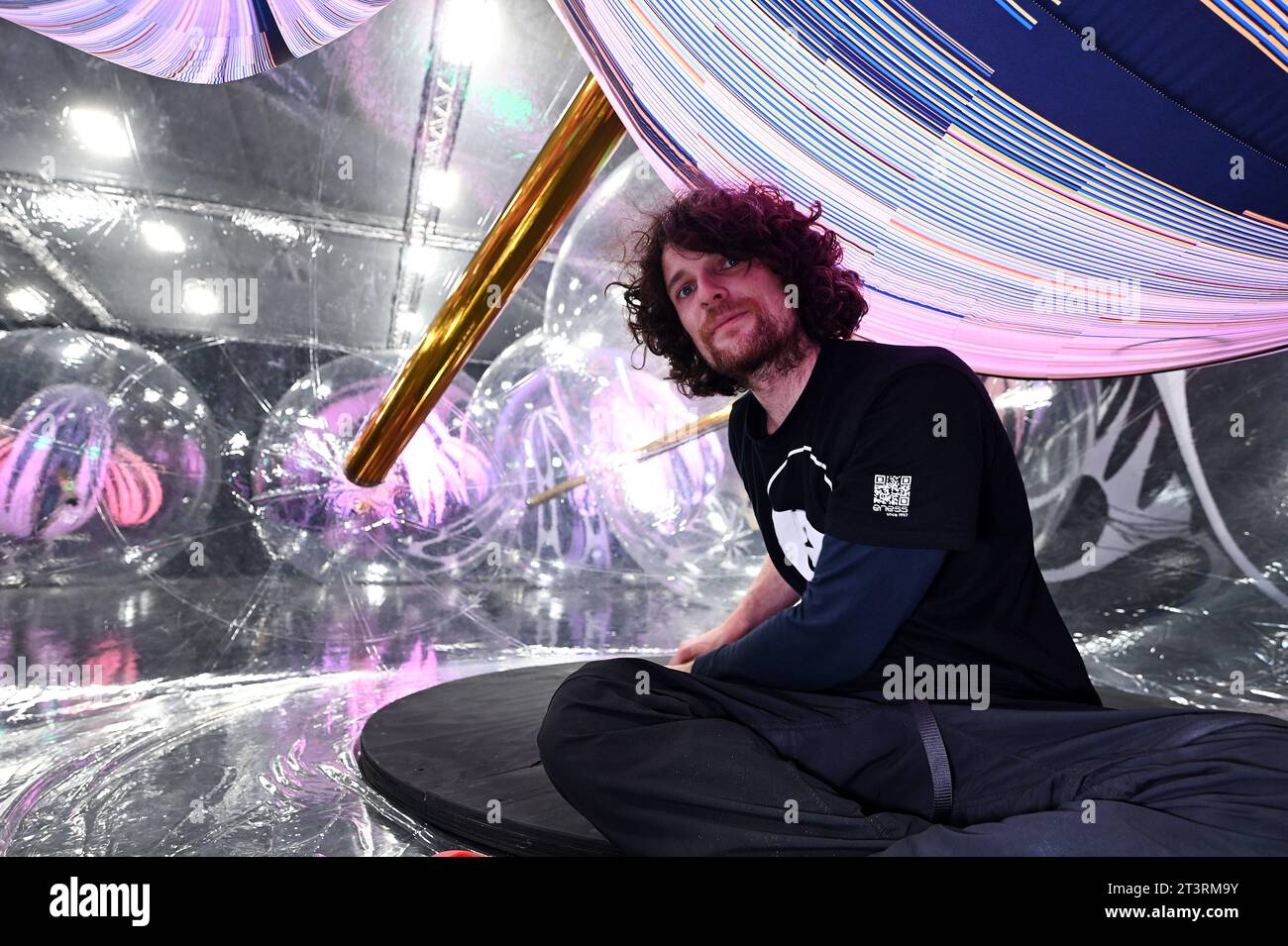 New York, USA. 26th Oct, 2023. Artist Tom Watson sits inside one of his ...