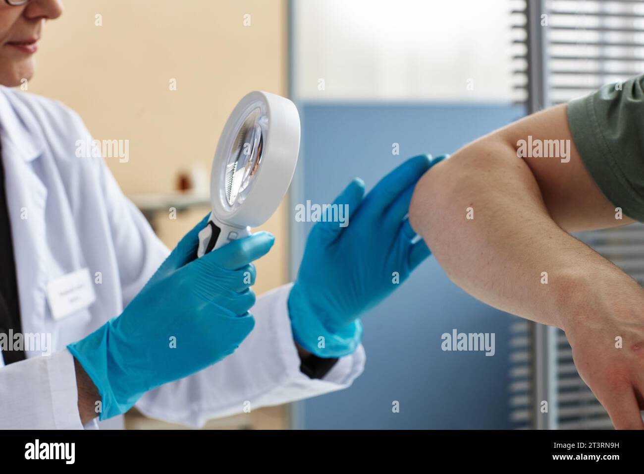 Close up of female doctor holding magnifying glass and inspecting ...