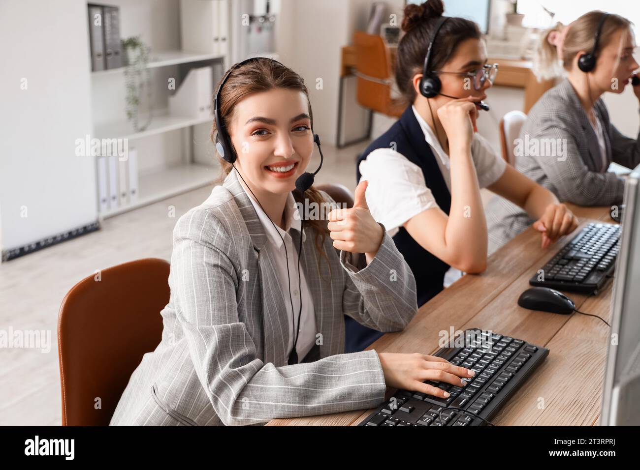Female technical support agents working in office Stock Photo - Alamy