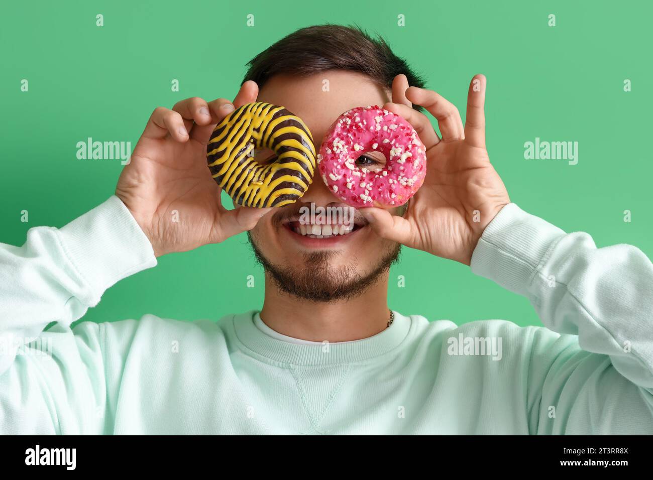 Man eating tasty donuts hi-res stock photography and images - Alamy
