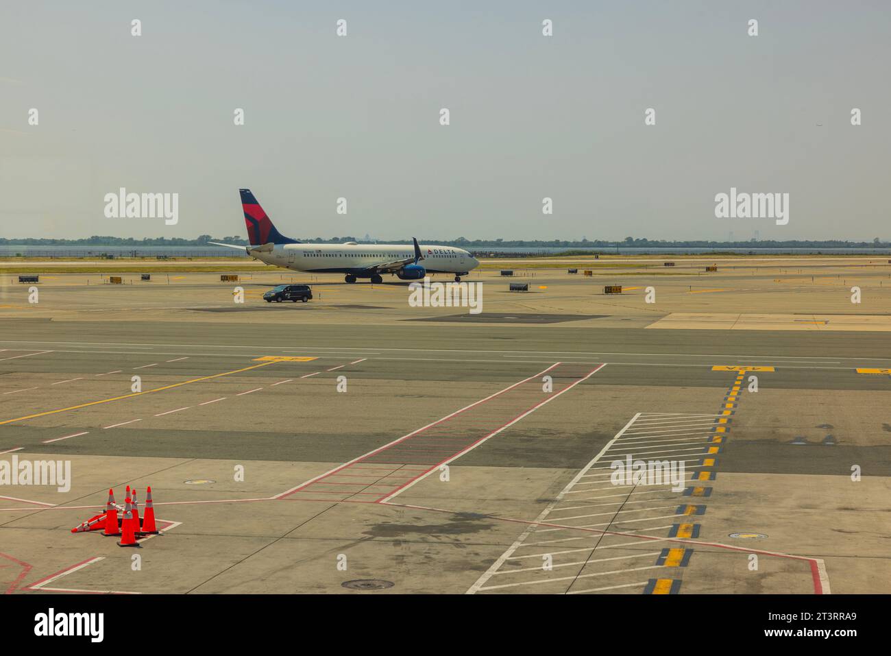 Beautiful view of airport runway on clear morning, with Delta airline ...