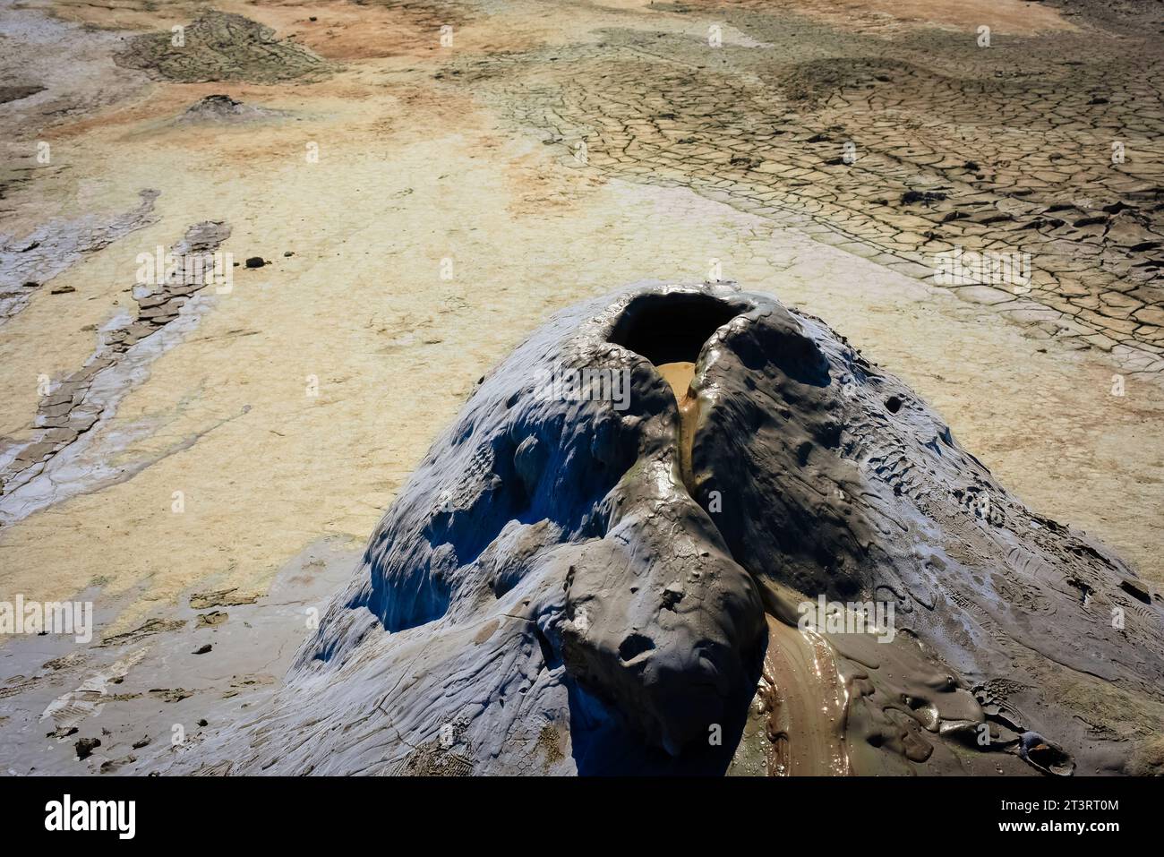 cones of mud volcanoes from which rivers of mud flow Stock Photo - Alamy