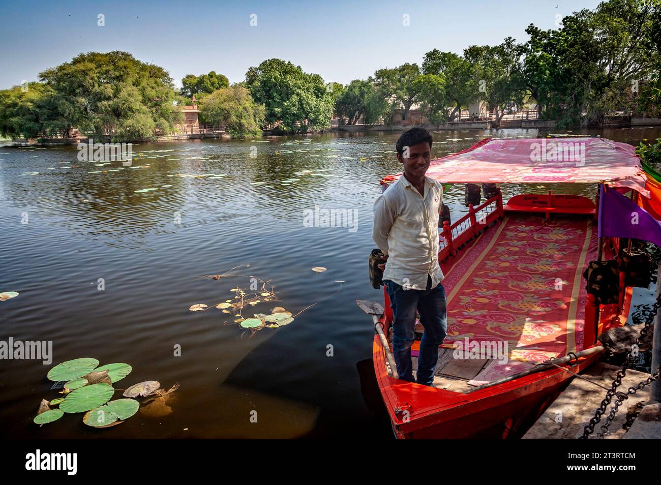 Boat man standing in Kolayat Lake, Kolayat, Rajasthan, India Stock ...