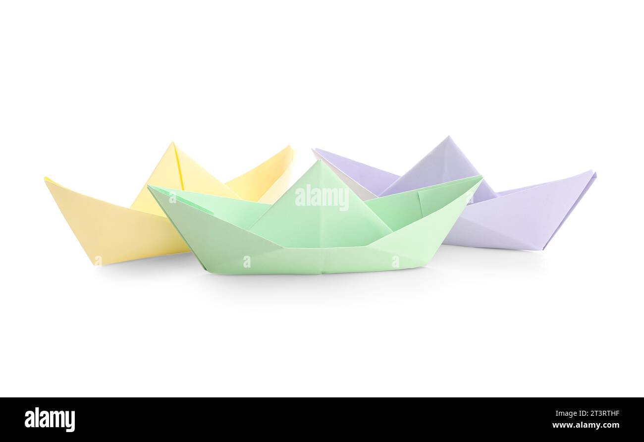 Colorful origami boats on white background Stock Photo - Alamy