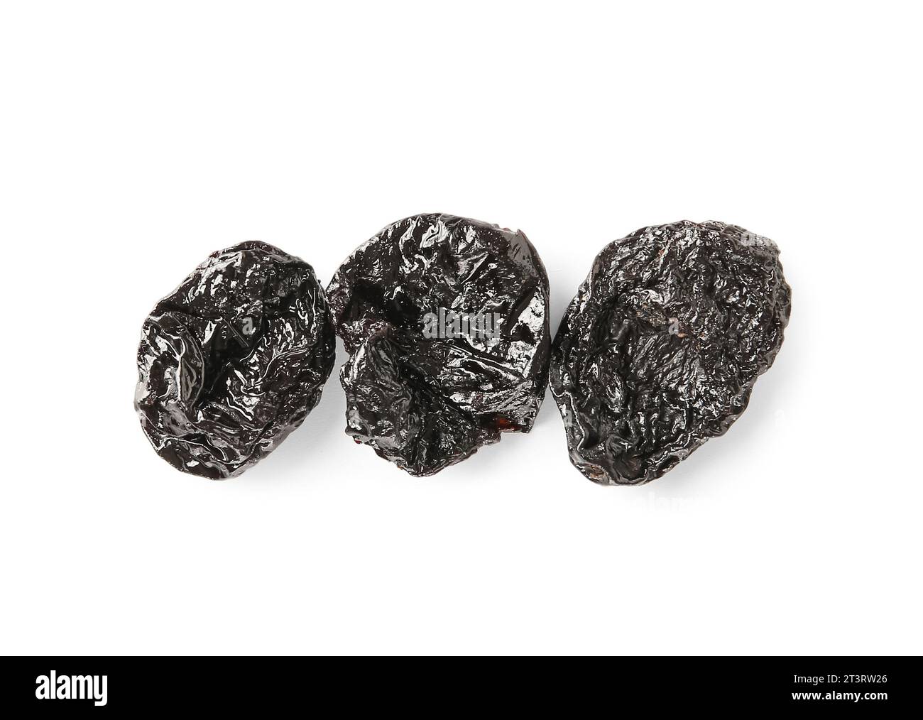 Tasty dried plums on white background Stock Photo - Alamy