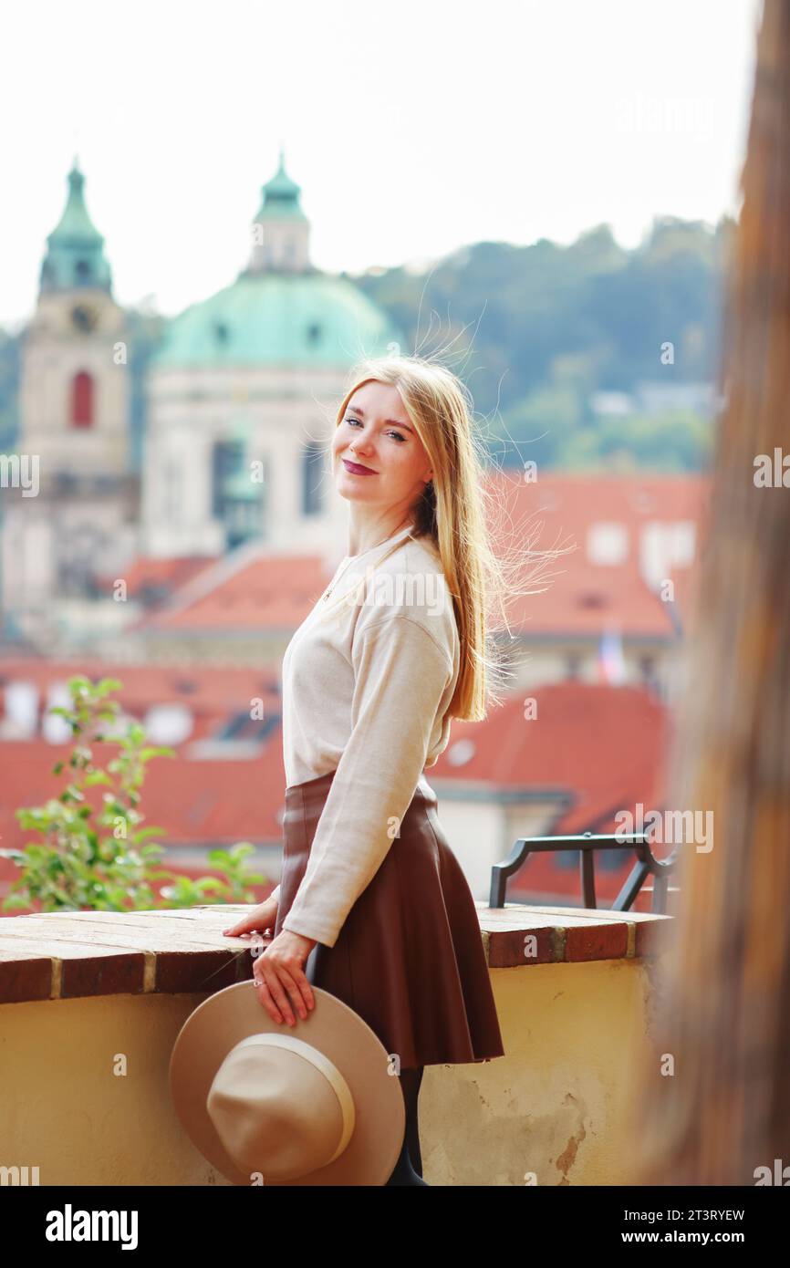 Girl in a beige hat, admiring the panorama of the city, Prague, Czech ...