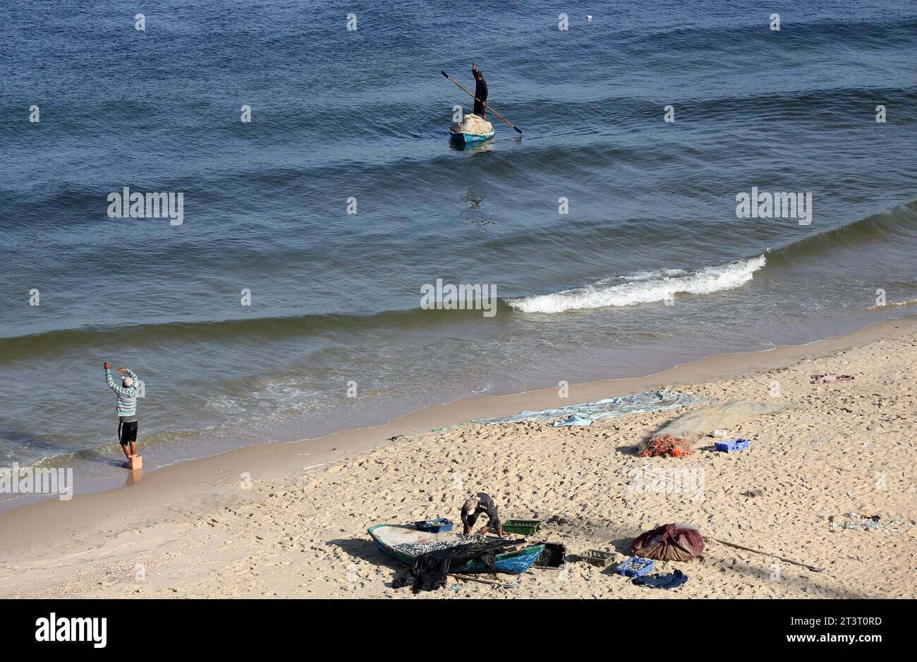 Palestinian fishermen fishing on the beach of Al-Nusirat central Gaza ...