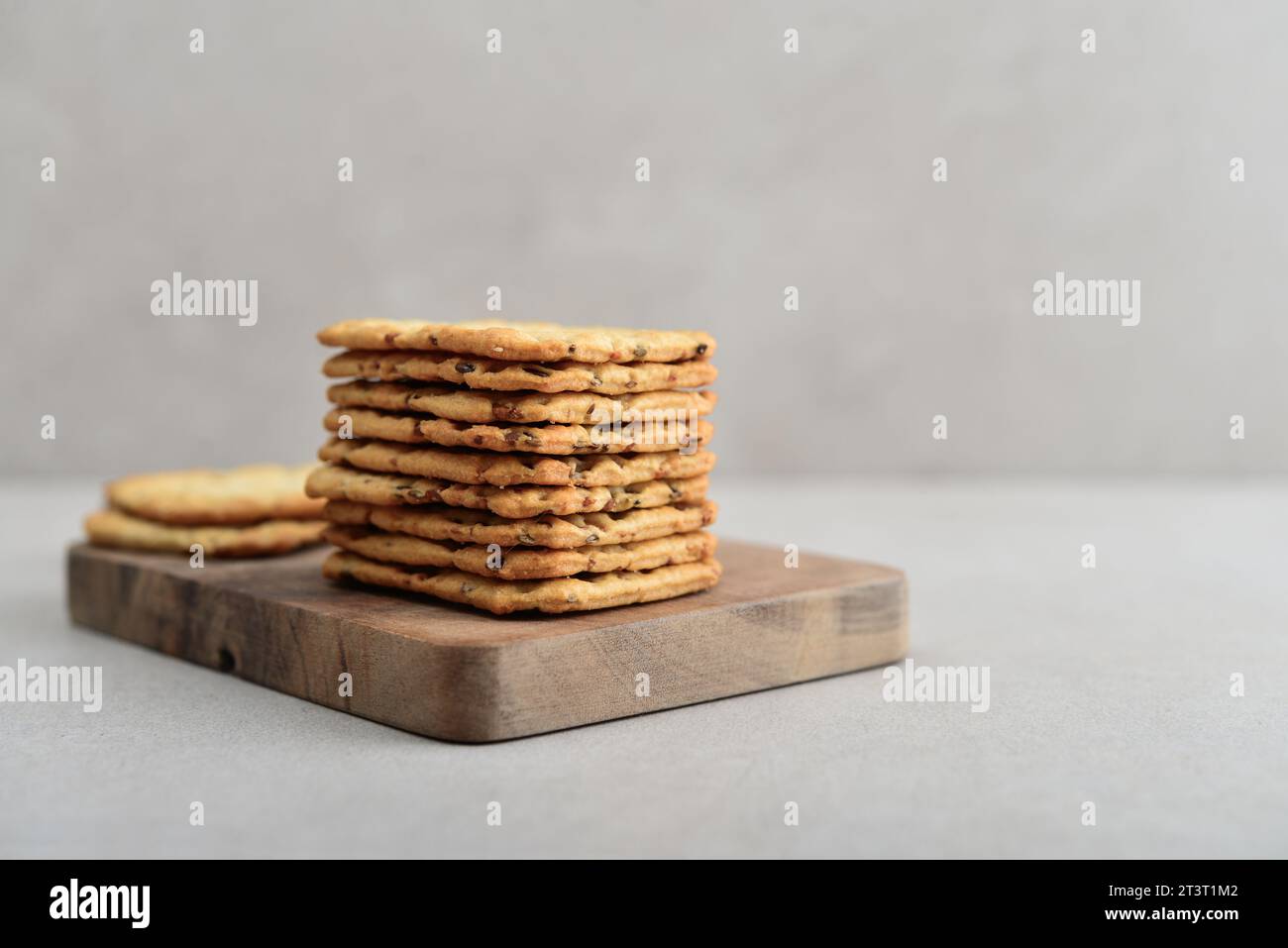 Multigrain crunchy cookies with flax and sesame seeds on wooden cutting ...