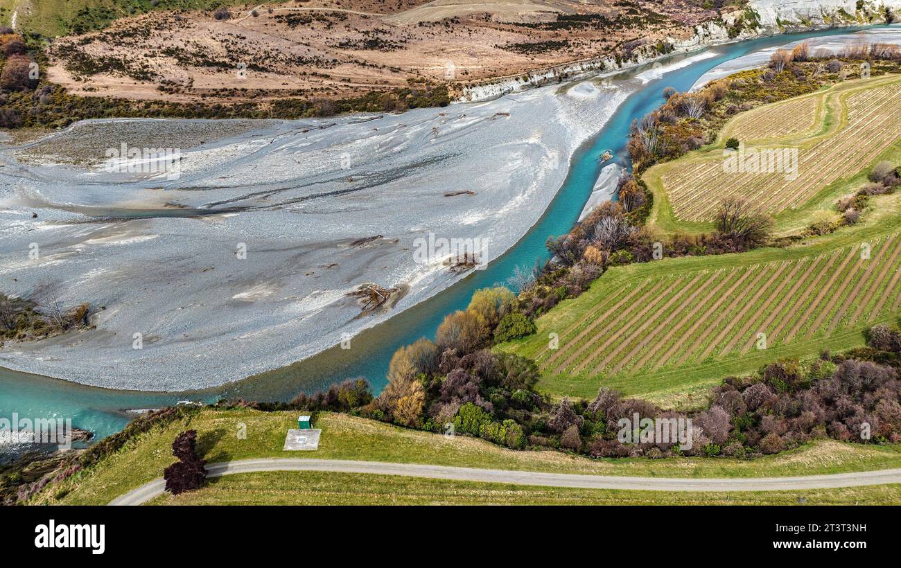 The blue water of the Awatere river flowing through agricultural ...