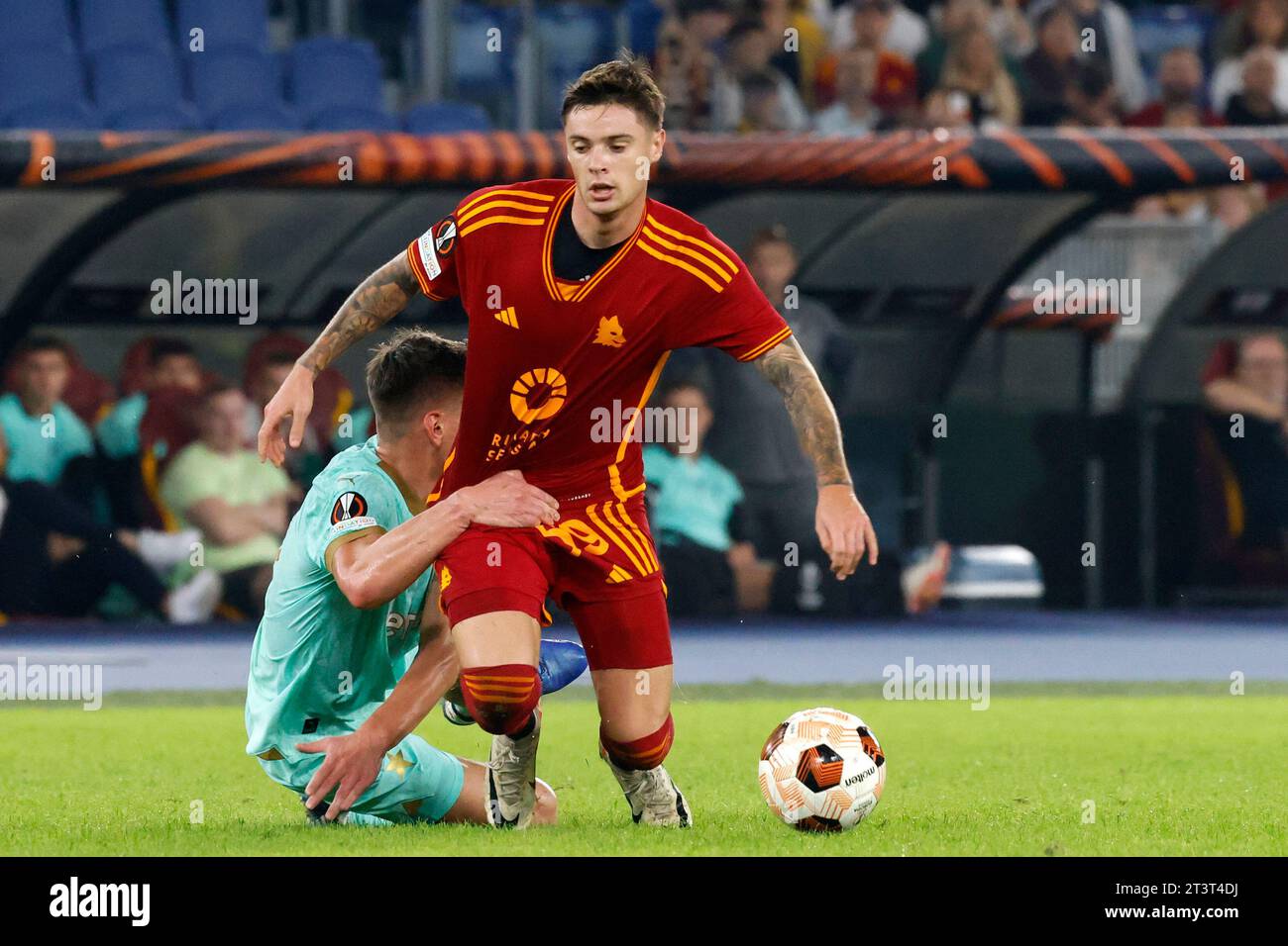 Rome, Italy. 26th Oct, 2023. Nicola Zalewski, right, of AS Roma, is fouled by Lukas Masopust, of ...