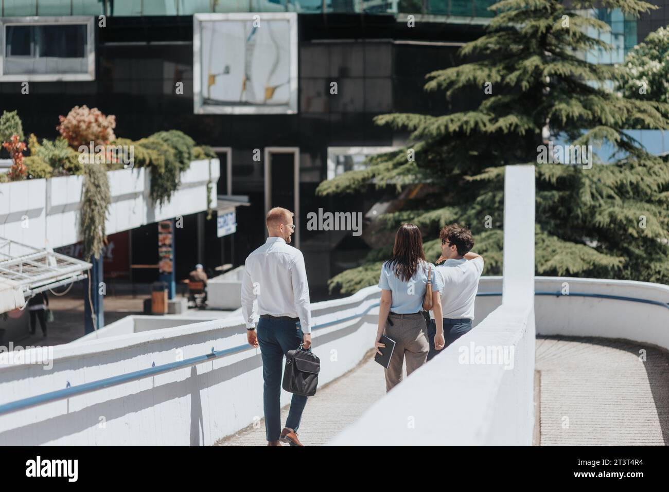 People talking while going home together after work Stock Photo - Alamy