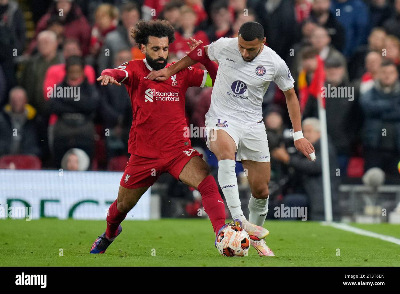 Mohamed Salah #11 of Liverpool competes for the ball with Yanis ...