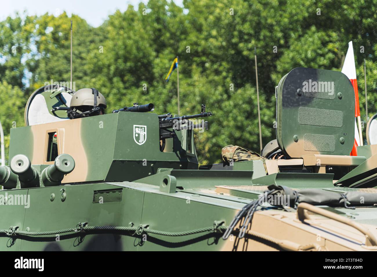 Portrait of commender's hatch in a military tank. Two soldiers peeking ...