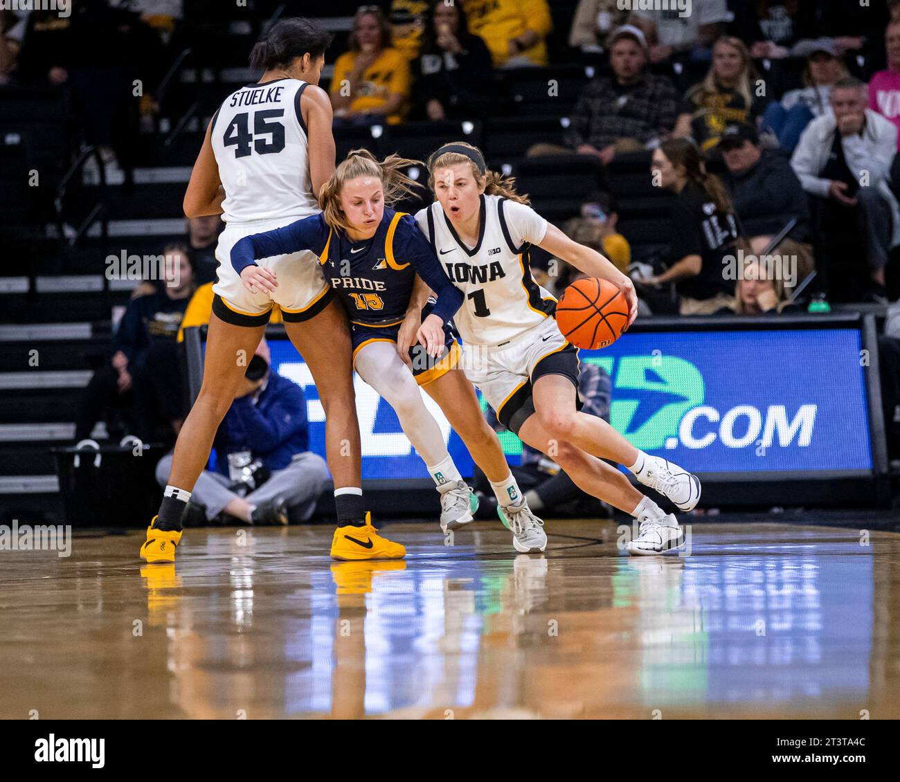 Iowa Hawkeyes guard Molly Davis (1) dribbles as Clarke Pride guard Maci ...