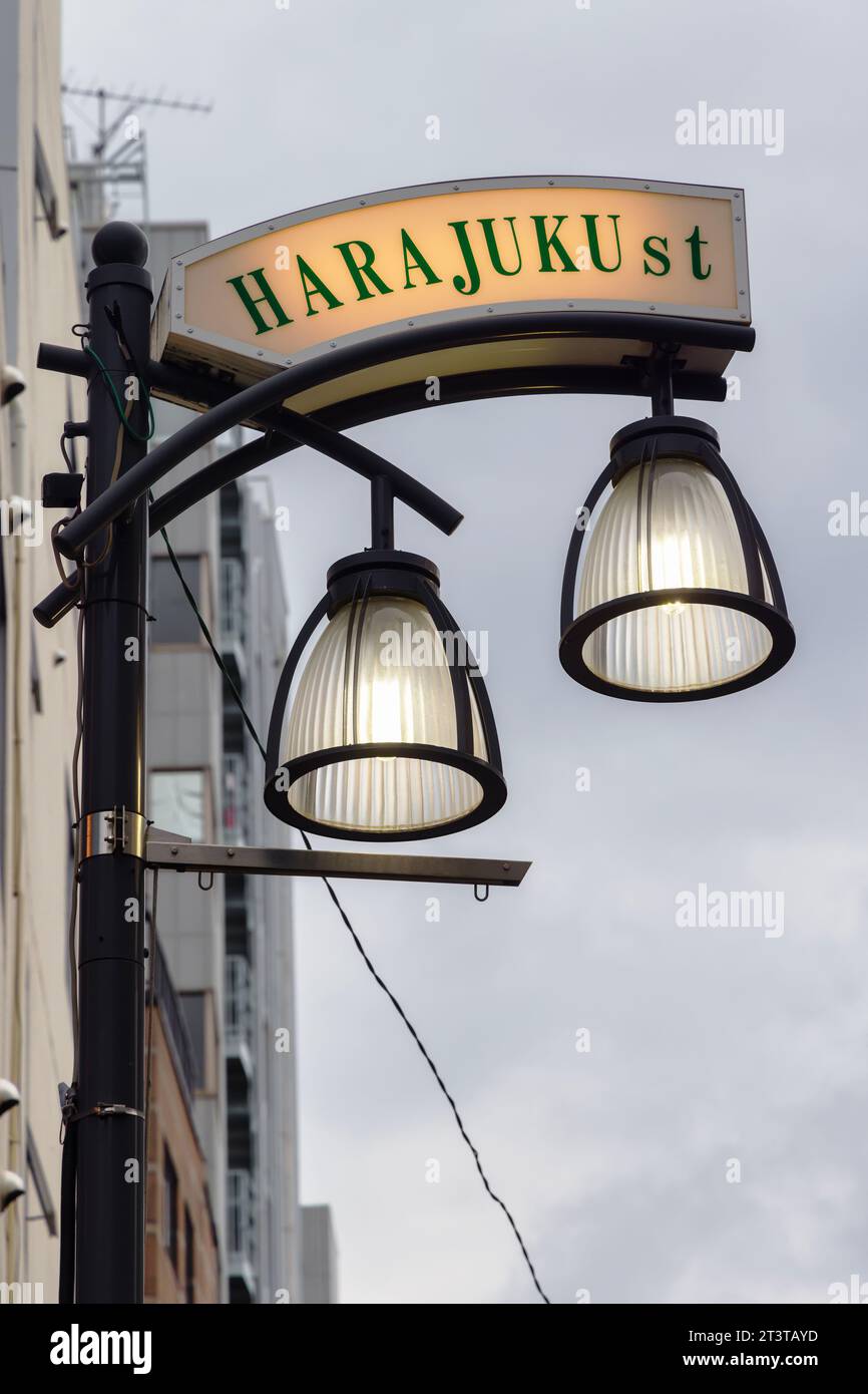street sign of Harajuku Street with illuminated street lamps in Tokyo ...