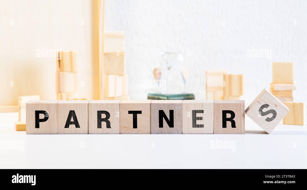 Partners Word Written In Wooden Cube Stock Photo - Alamy
