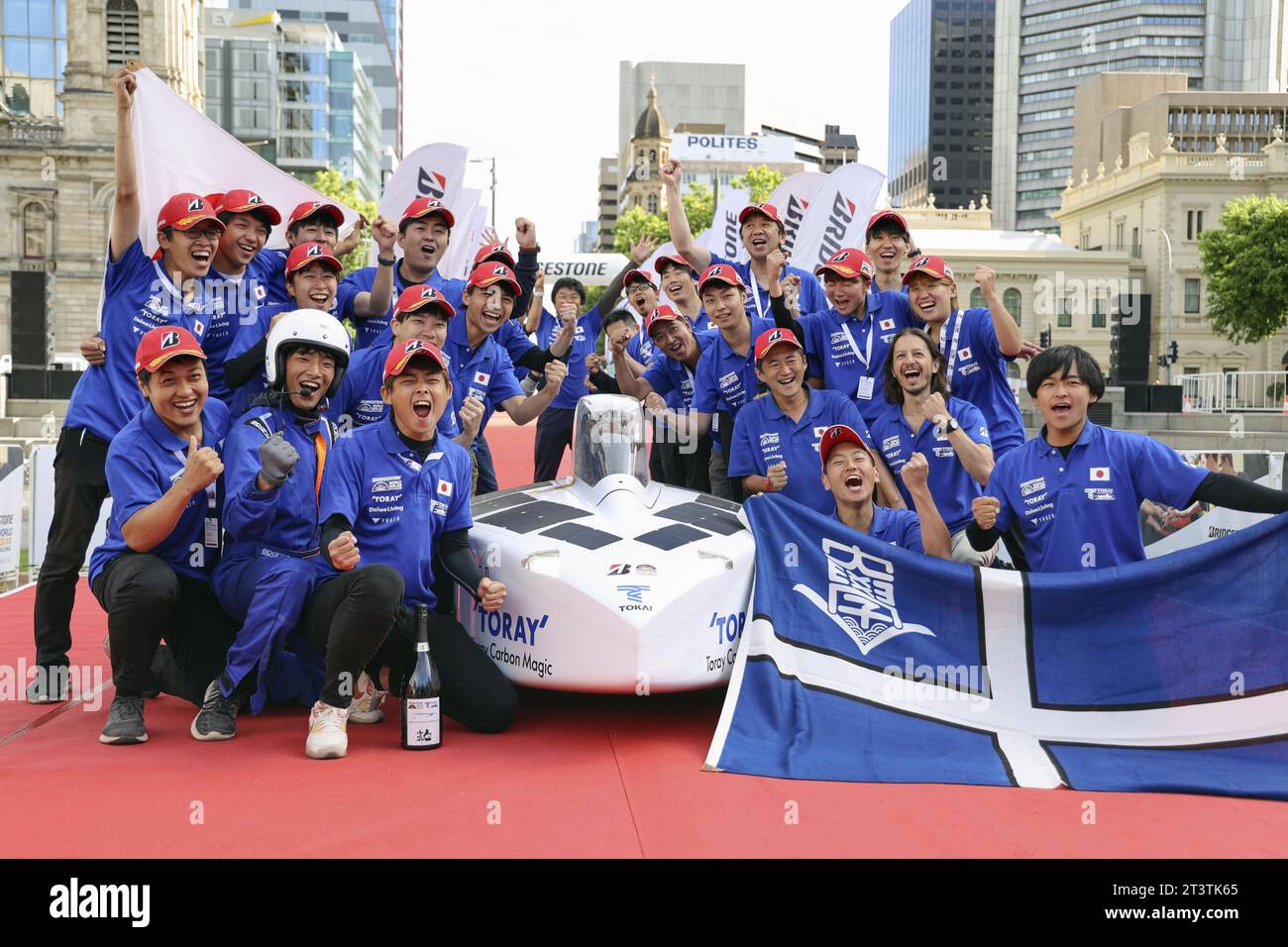 Members of Japan's Tokai University solar team pose for a photo after ...