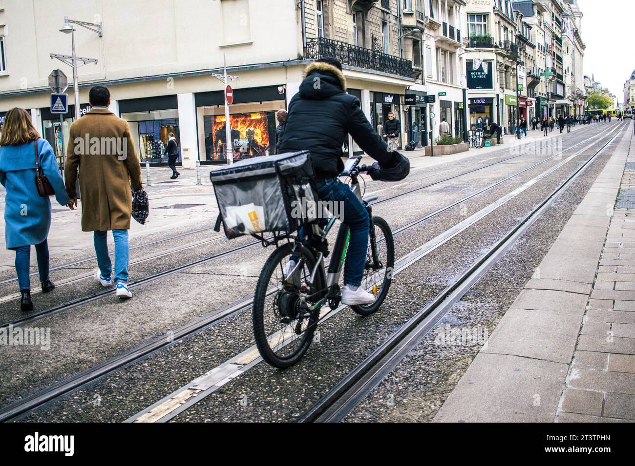 Reims, France - October 26, 2023 People rolling with a bicycle in the ...