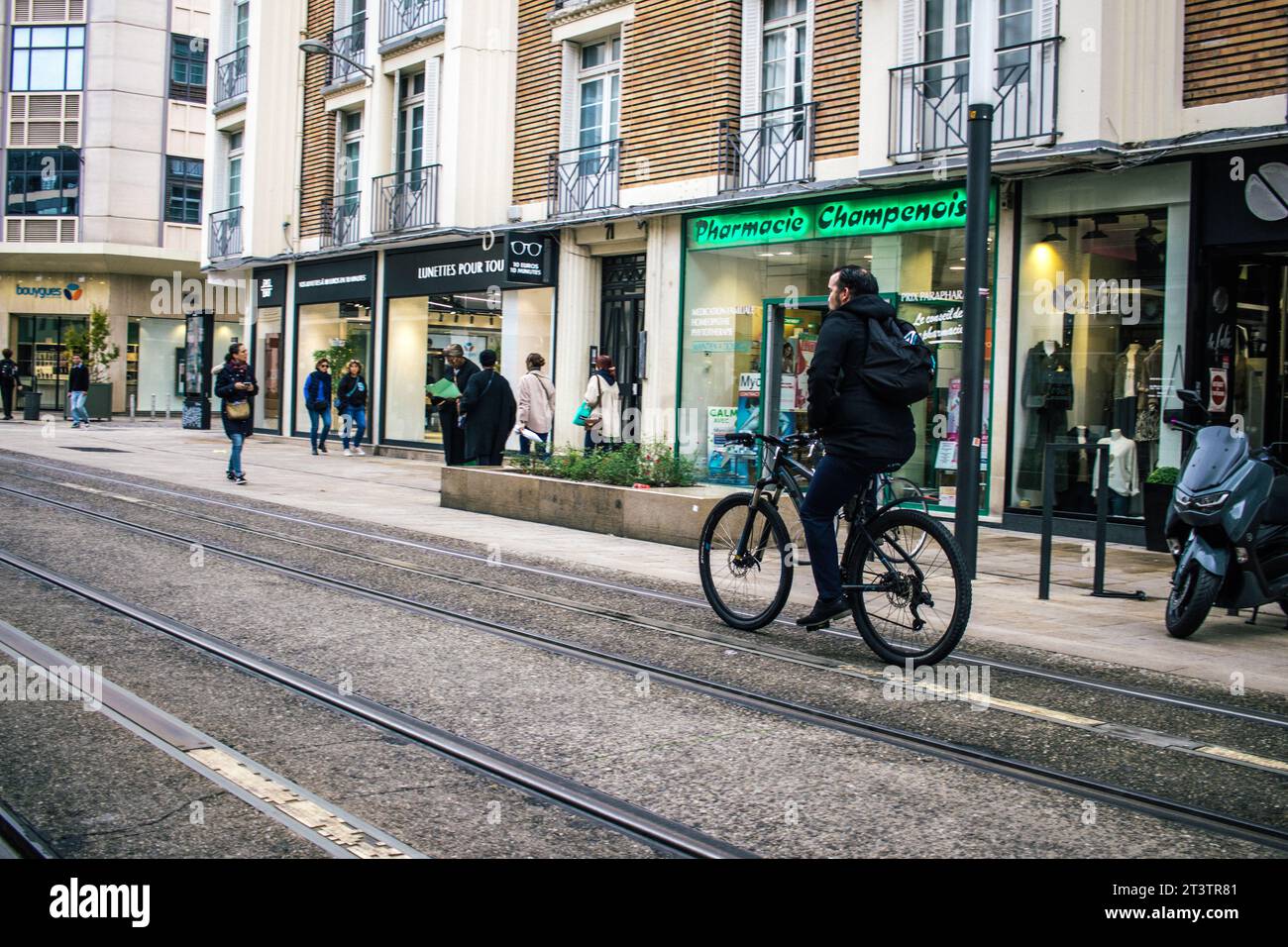 Reims, France - October 26, 2023 People rolling with a bicycle in the ...