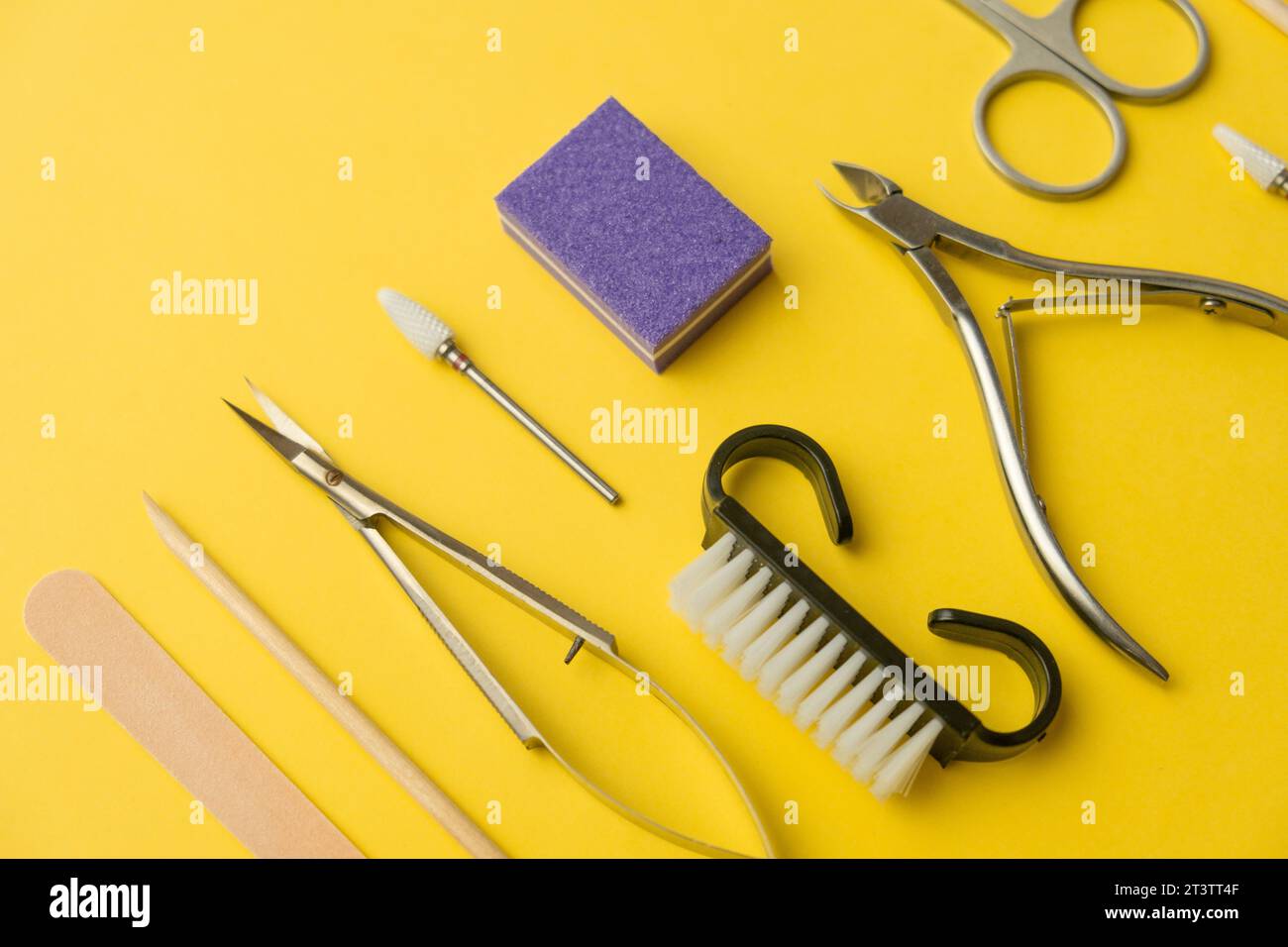 Professional manicure tools on yellow background. Manicure set Stock ...