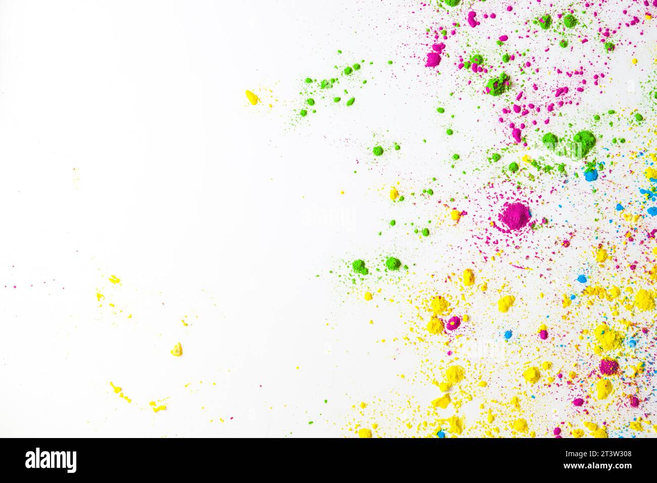 Overhead view colorful holi power white background Stock Photo - Alamy