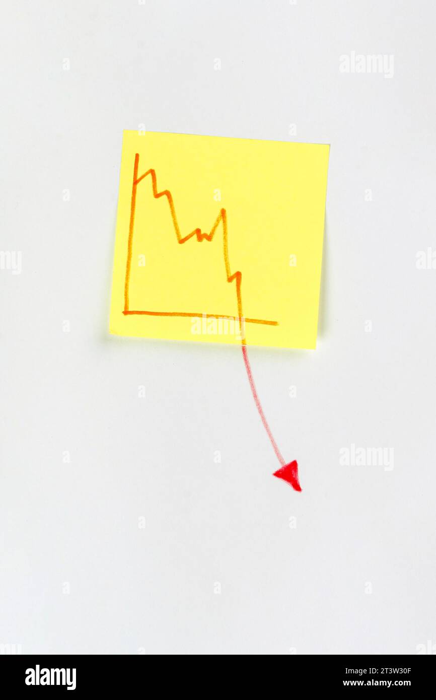 Note with chart economy decreasing Stock Photo - Alamy