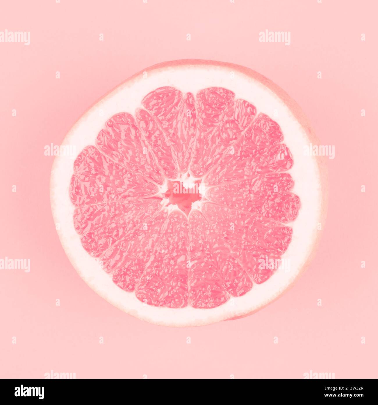 Pink halved fresh juicy grapefruit pink background Stock Photo - Alamy