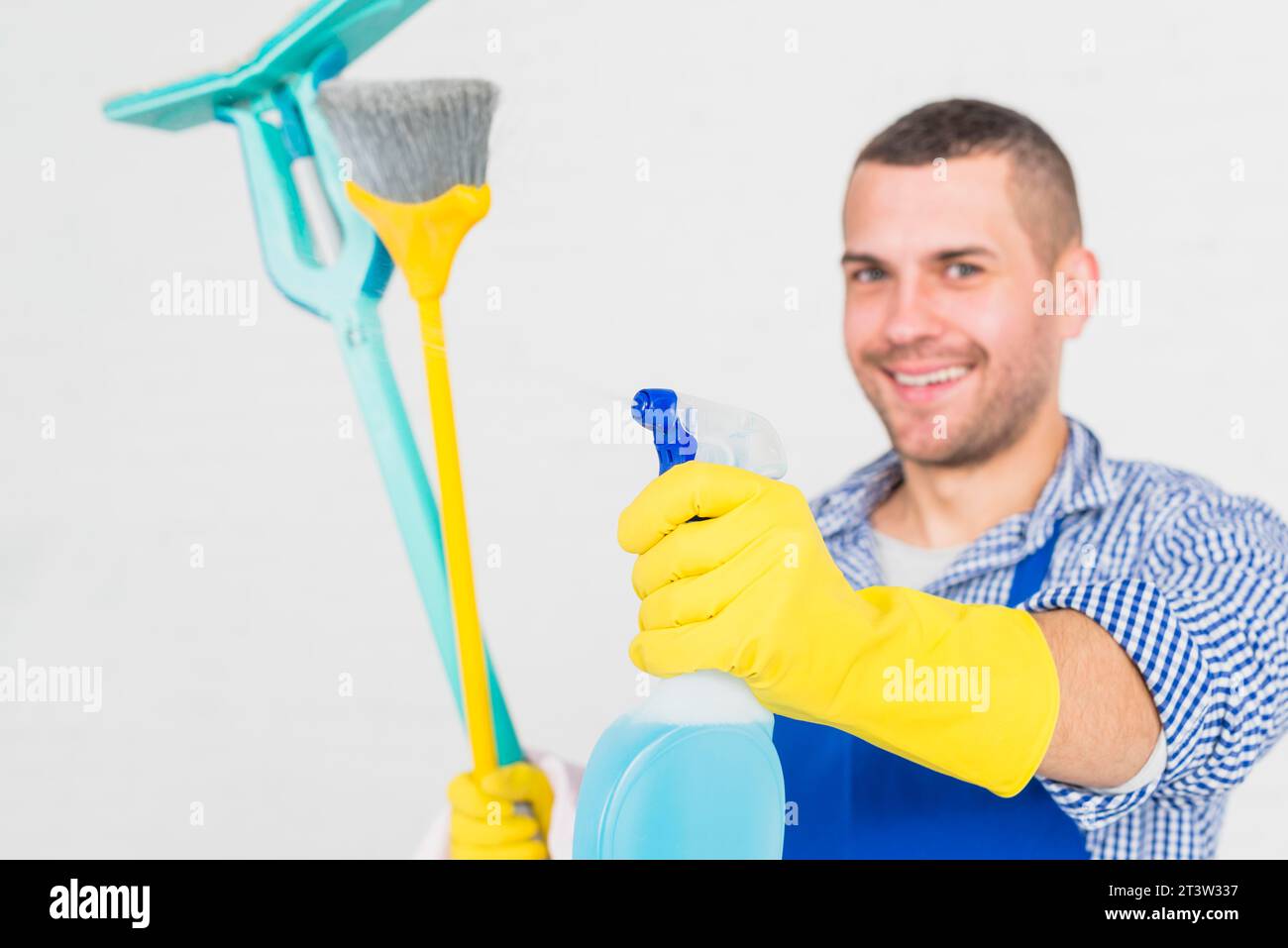 Portrait man cleaning his home Stock Photo - Alamy