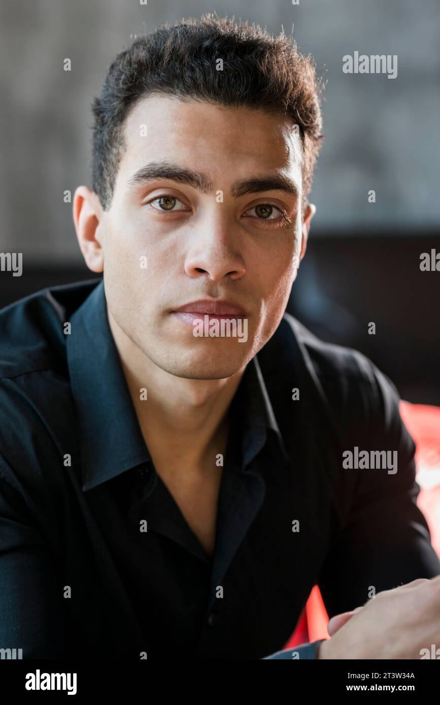 Portrait handsome young man looking camera Stock Photo - Alamy